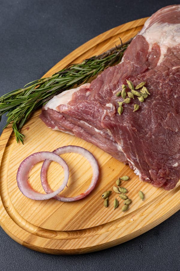 Large Raw Piece of Meat on a Black Background Stock Photo - Image of ...