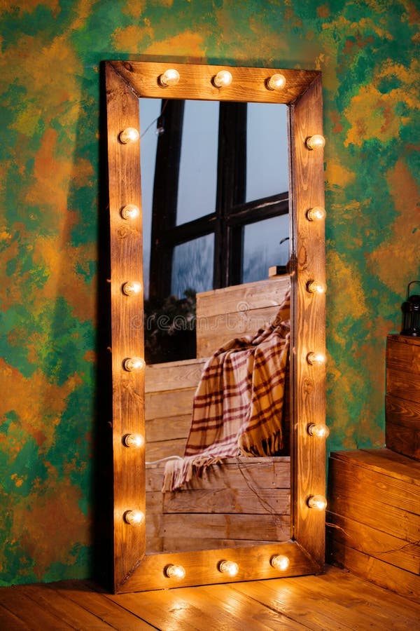 A Large Rectangular Mirror with a Wooden Frame and Light Bulbs Stock ...