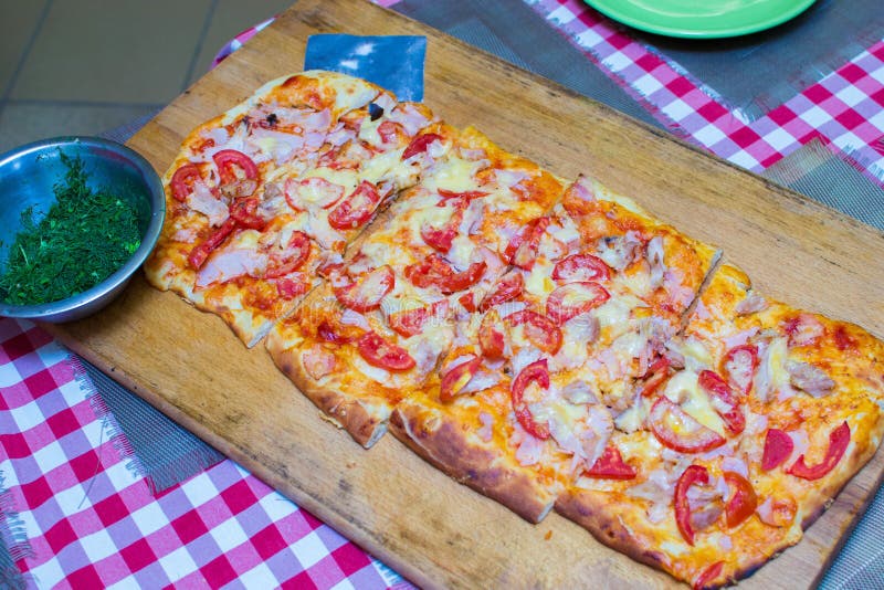Large Rectangular Pizza Sliced on a Wooden Board Stock Photo - Image of ...