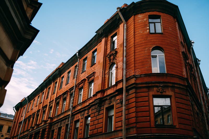 A Large Red Brick Building that Features a Lot of Numerous Windows ...