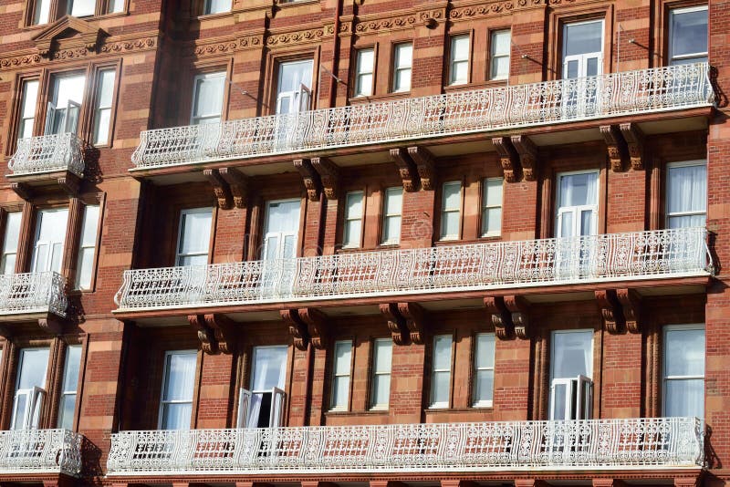 Large Red Bricked Hotel with White Balcony Stock Image - Image of ...