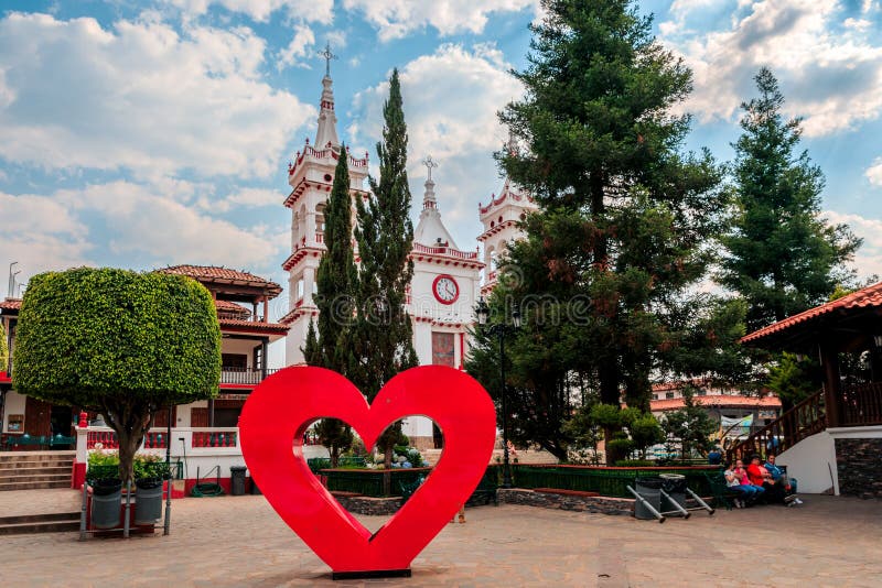 A Large Red Heart on a Square with Benches and Trees Editorial ...