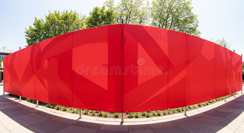 Large Red Panels Form a Curved Temporary Construction Barrier. the ...
