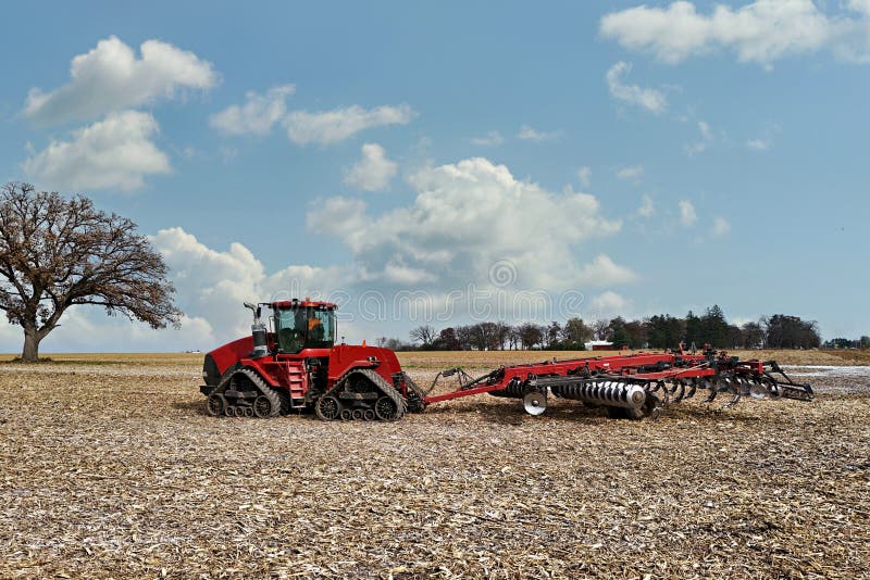 Large Red Tracked Tractor Getting Ready To Cultivate a Field with a ...