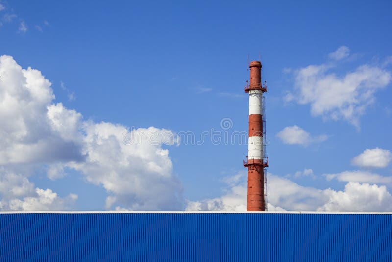 Large Red White Factory Chimney Against a Blue Sky Stock Photo - Image ...