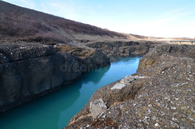 Large River Flowing through Large Rock Formations Stock Image - Image ...