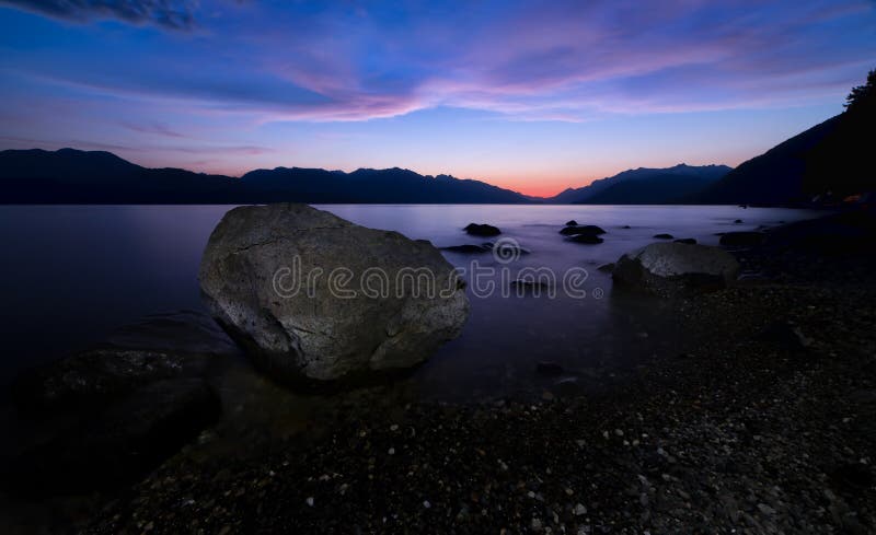 Large Rock Along Lake Shore at Night Stock Image - Image of evening ...