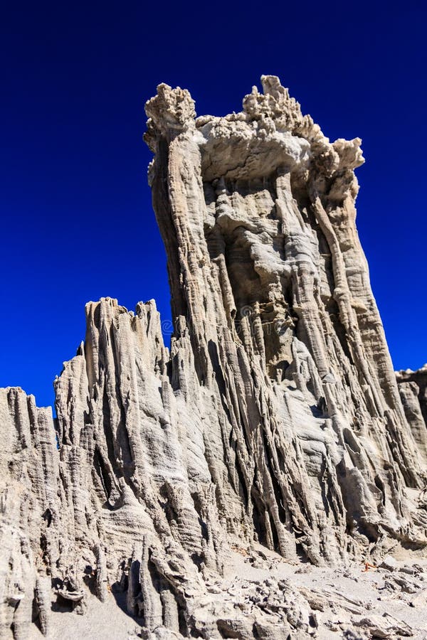 A Large Rock Formation with a Blue Sky in the Background Stock Image ...