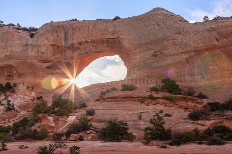 A Large Rock Formation with a Large Hole in the Middle Stock Photo ...