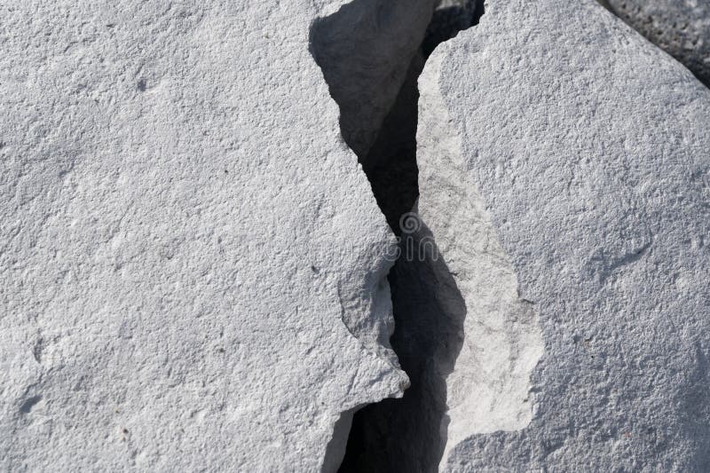 A Large Rock Has Cracked into Two, it Looks Like a Crevasse Stock Image ...
