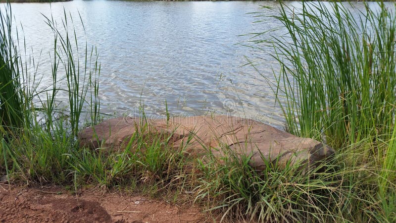 Boulder at waters edge stock image. Image of deserted - 103741509