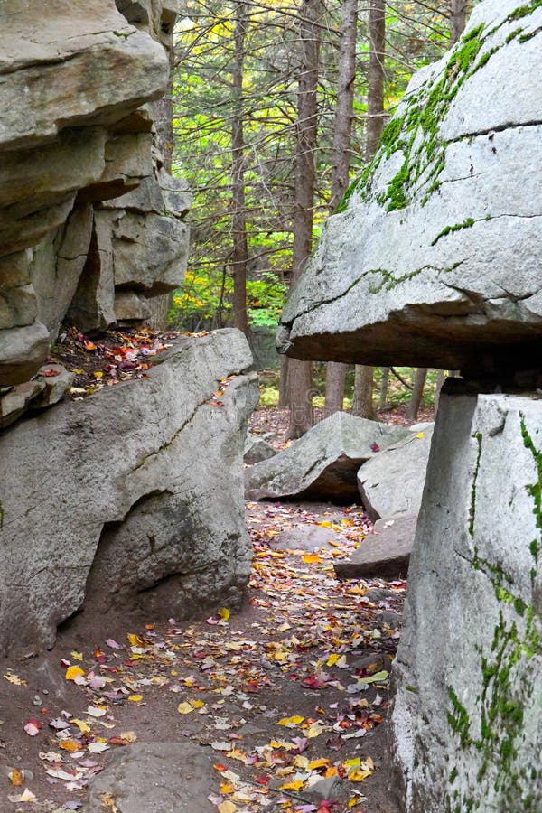 Rock Overhang on Path in Woods Stock Photo - Image of conditionier ...