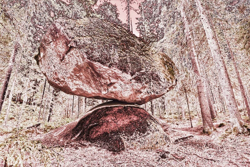 A Large Rock Precariously Balanced on Another within a Forest Setting ...