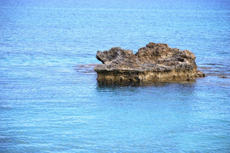 Large rock in the sea stock photo. Image of rock, water - 355732452