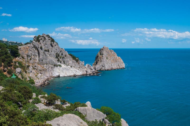 A Large Rock Sticking Out Above the Sea. Stock Photo - Image of scenery ...