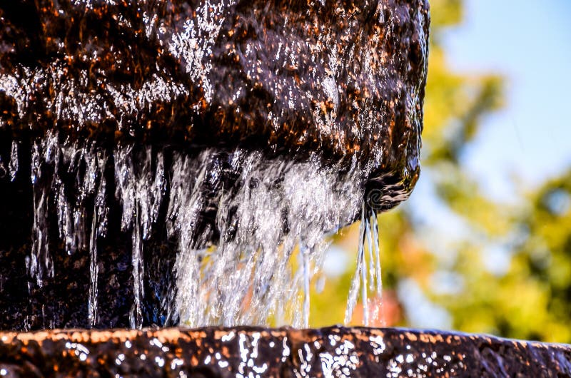 A Large Rock with Water Dripping from it Stock Image - Image of ...