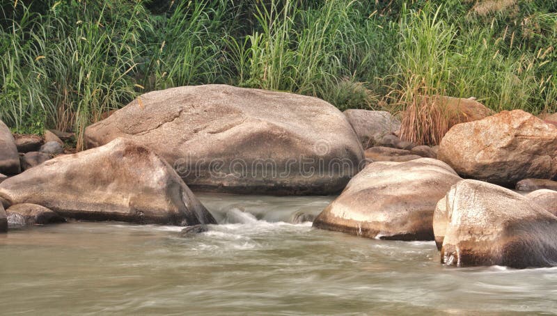 Large Rocks on the Banks of a Quiet River. Stock Image - Image of river ...