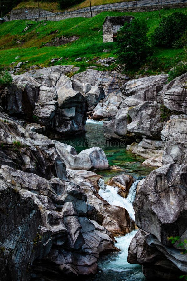 Large Rocks Sit in a Narrow River Filled with Water in a Mountain Area ...