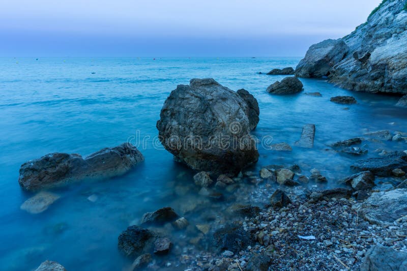 Large Rocks Over the Sea with a Silk Effect Stock Photo - Image of ...