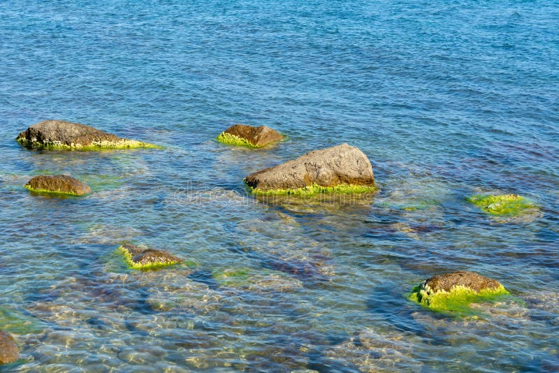 Large rocks in the sea stock photo. Image of large, sunny - 133702062