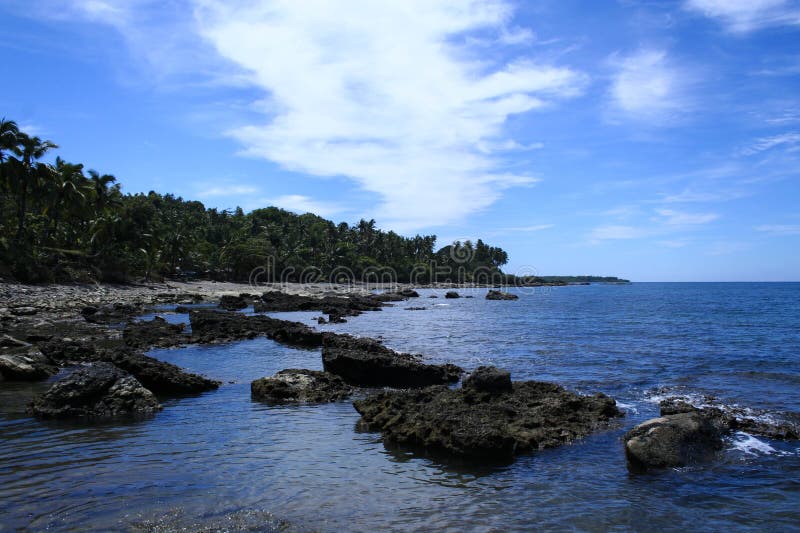 Large Rocks on Seashore Under White Cloudy Sky during Daytime Stock ...