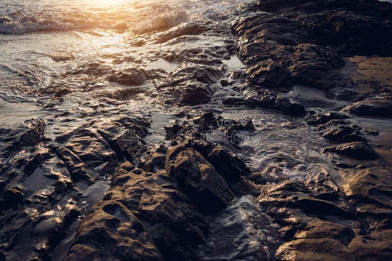 A Large Rocks Surrounded by Waves of the Ocean Stock Image - Image of ...