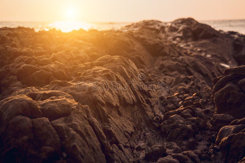 A Large Rocks Surrounded by Waves of the Ocean Stock Photo - Image of ...