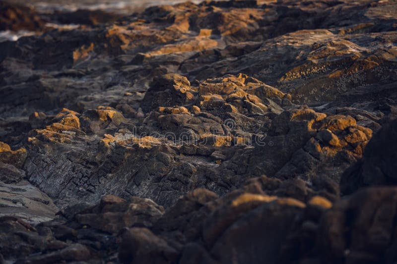 A Large Rocks Surrounded by Waves of the Ocean Stock Image - Image of ...