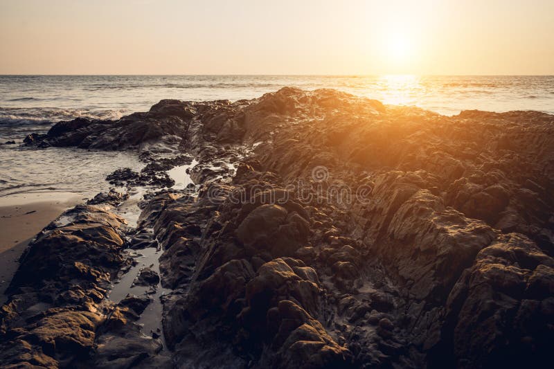 A Large Rocks Surrounded by Waves of the Ocean Stock Image - Image of ...