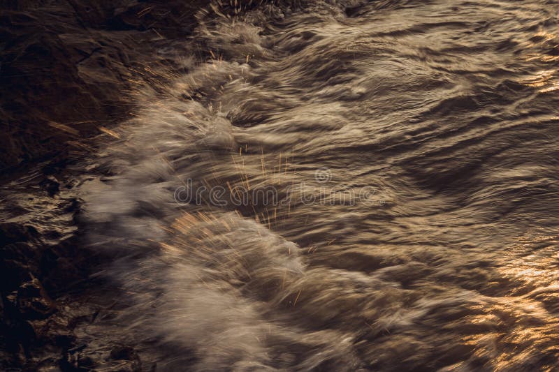 A Large Rocks Surrounded by Waves of the Ocean Stock Image - Image of ...