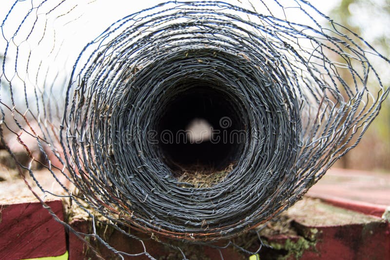 Roll of Chicken Wire Laying on an Old Red Picnic Table Stock Image ...