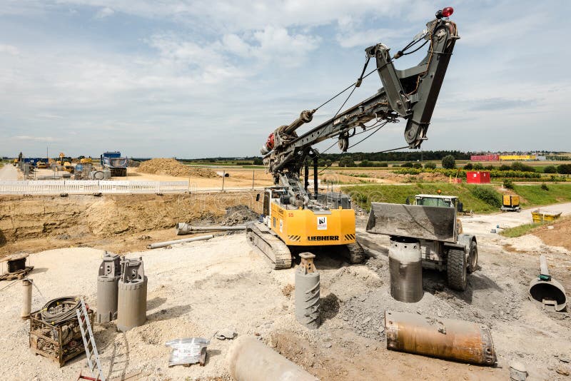 Large Rotary Drill and Excavator on Construction Site Editorial Stock ...