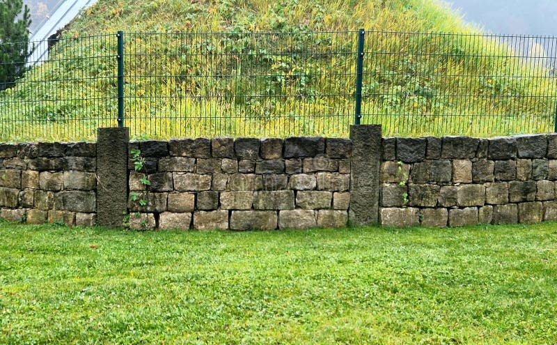 Large Rough Rock Blocks in a Retaining Wall in the Garden Stock Photo ...