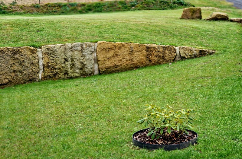 Large Rough Rock Blocks in a Retaining Wall in the Garden. Stock Image ...
