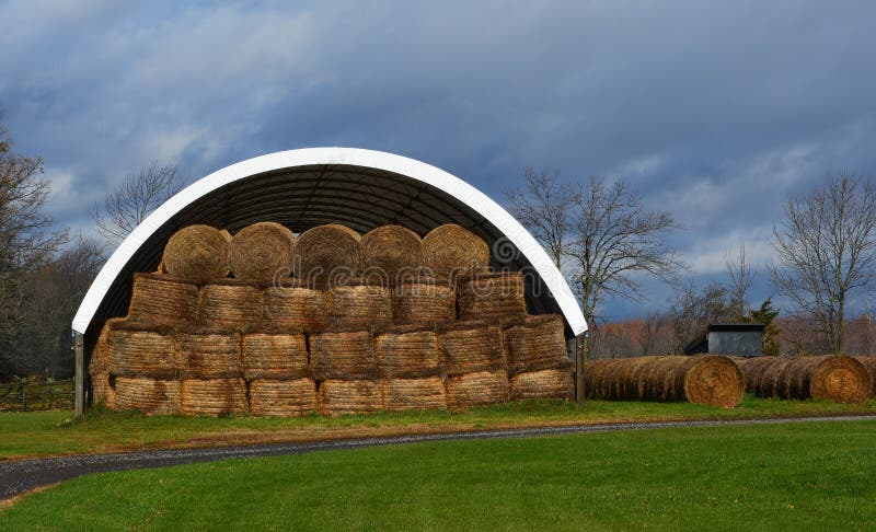 Large Round Bales in Storage Stock Photo - Image of bales, grass: 64829008