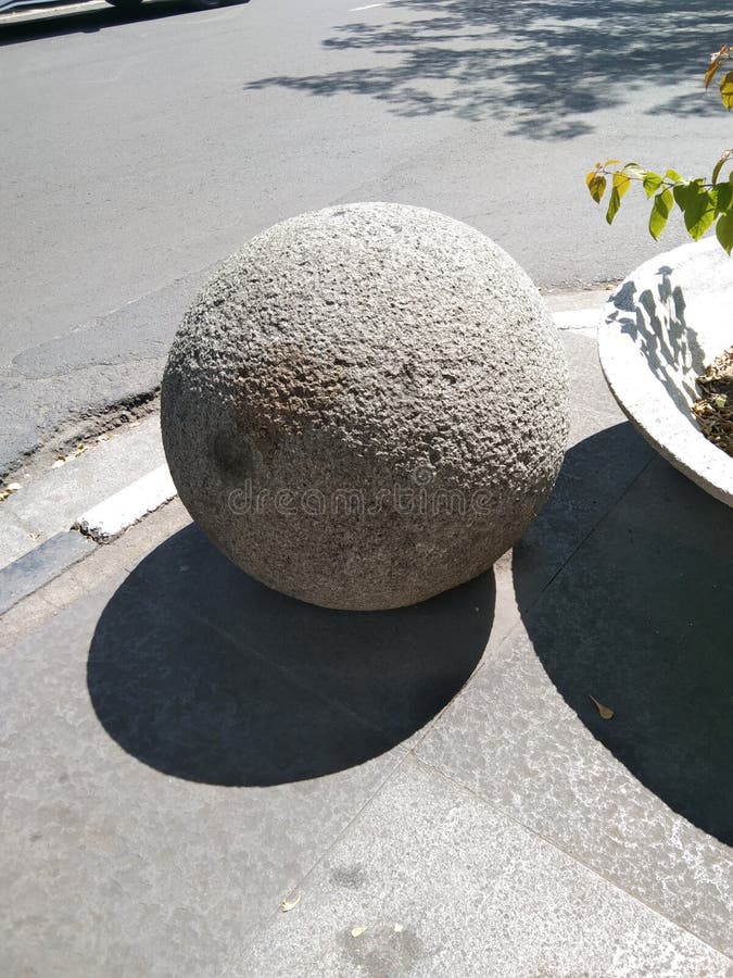 A Large Round Cast Stone on the Pavement Stock Image - Image of circle ...