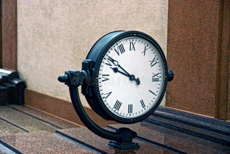 Large Round Clock on the Marble Wall of the Building Stock Image ...