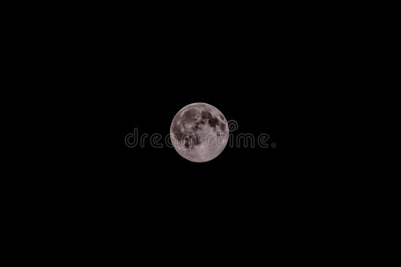 A Large, Round Moon is in the Sky Above a Black Background Stock Photo ...