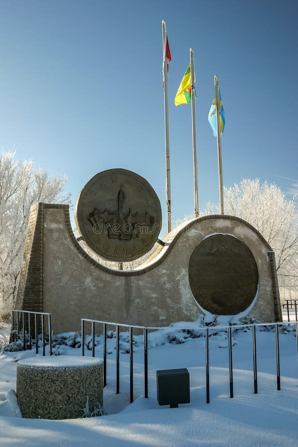 A Large, Round, Stone Monument with a Flag on Top Stock Photo - Image ...