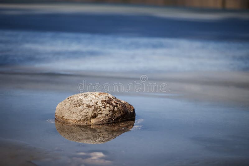 Large Round Stone Sitting on the Beach Stock Image - Image of rounded ...