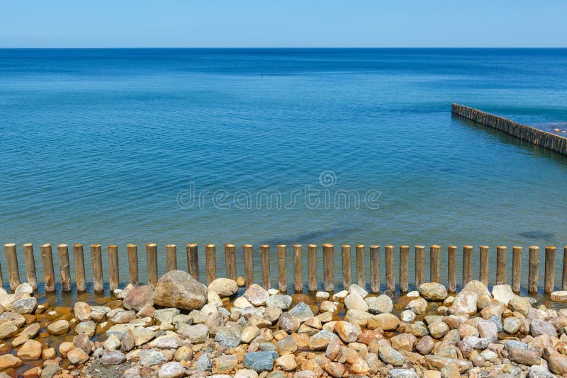 Large rubble on the beach stock photo. Image of riverside - 190981256