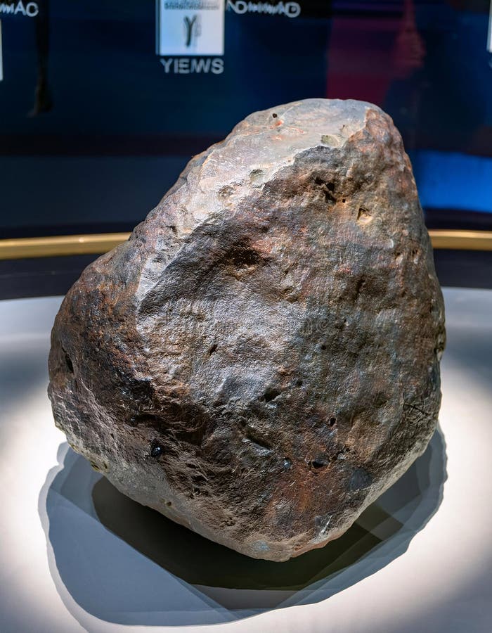 A Large, Rugged, Dark-colored Rock on Display Stock Illustration ...