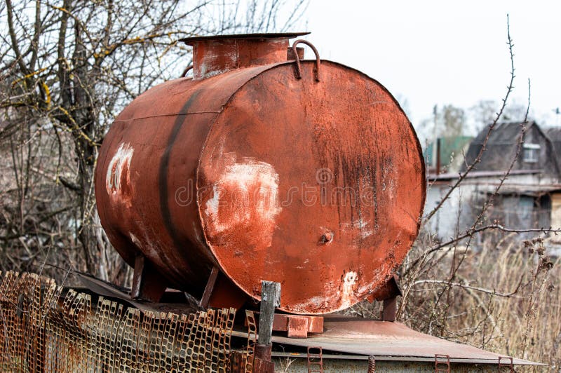 A Large Rusty Metal Container for Water at the Dacha Stock Image ...