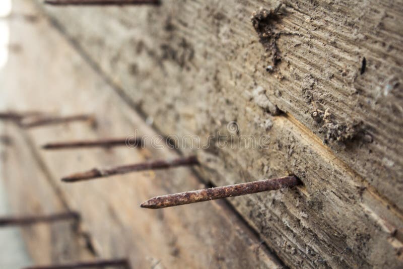 Large Rusty Nails Stick Out of Old Board Stock Image - Image of brown ...