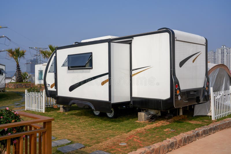 Large Camping Trailer in a Darkeing Campsite Stock Photo - Image of ...