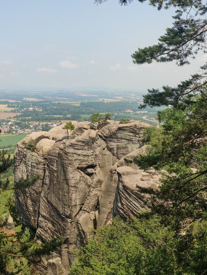 A Large Sandstone Cliff with a View of the Surrounding Valley and Hills ...