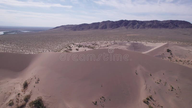 A Large Sandy Dune in the Middle of the Steppe Stock Video - Video of ...