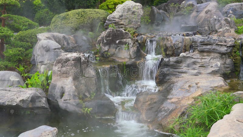Large-scale Rockery and Flowing Water Landscape in the Garden Stock ...