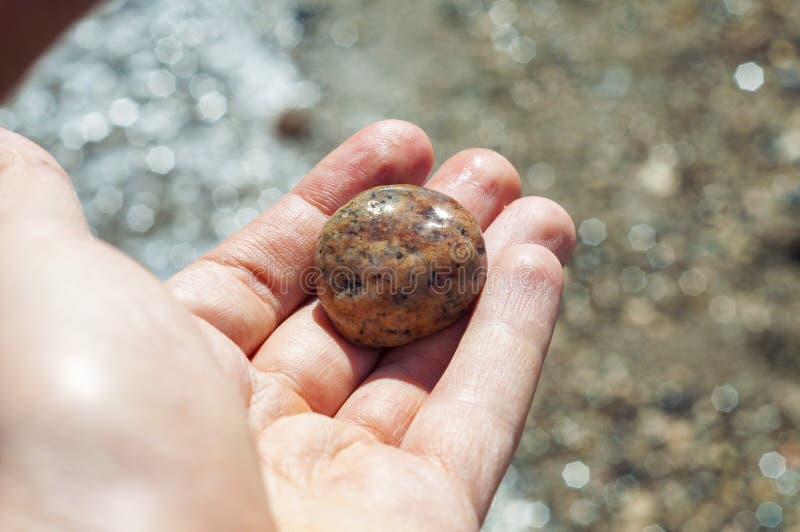 Large Sea Pebble in the Hand Palm Stock Photo - Image of peace, beauty ...