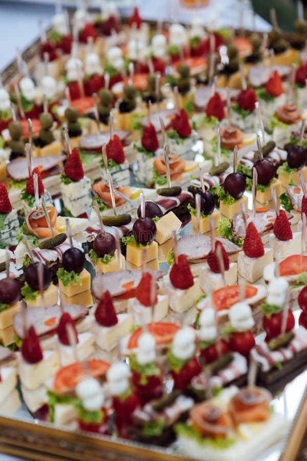 A Large Selection of Various Snacks for Guests on a Mirror Surface ...